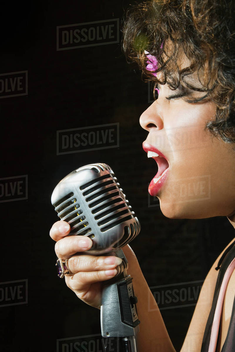 Close up of African female singer - Royalty-free Stock Photo | Dissolve