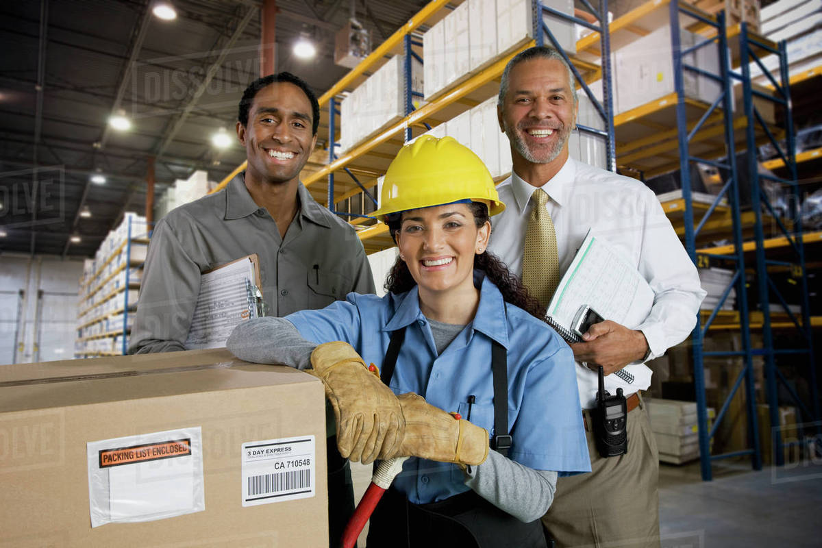 Multi-ethnic co-workers in warehouse - Royalty-free Stock Photo | Dissolve