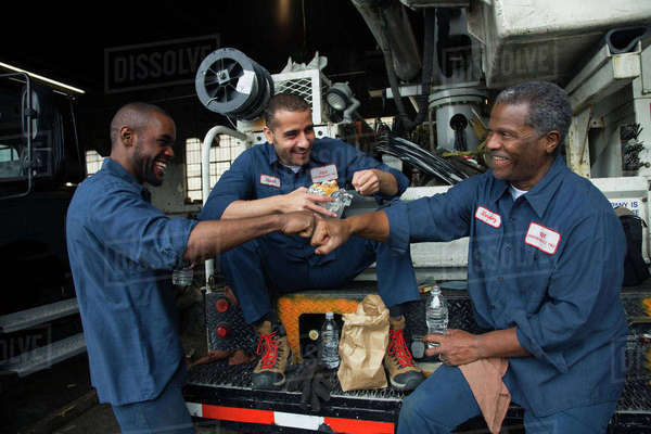 Mechanics eating lunch together - Royalty-free Stock Photo | Dissolve
