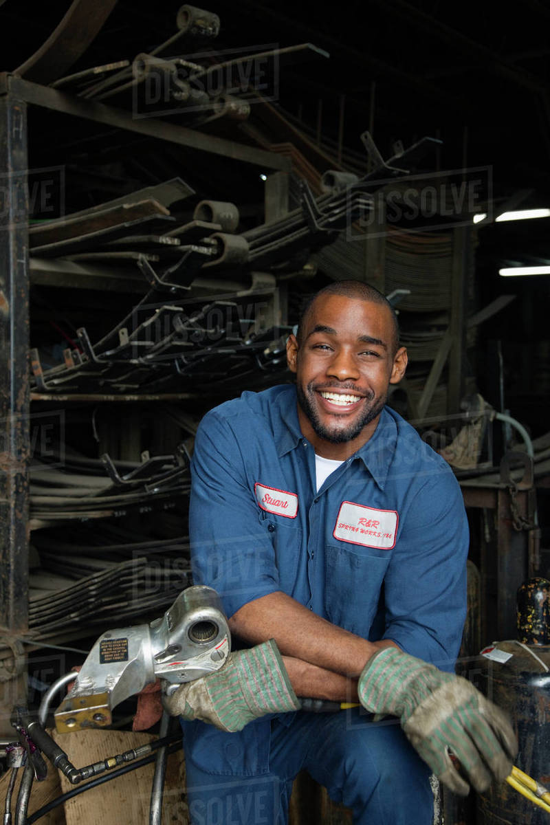 African mechanic in repair shop - Royalty-free Stock Photo | Dissolve