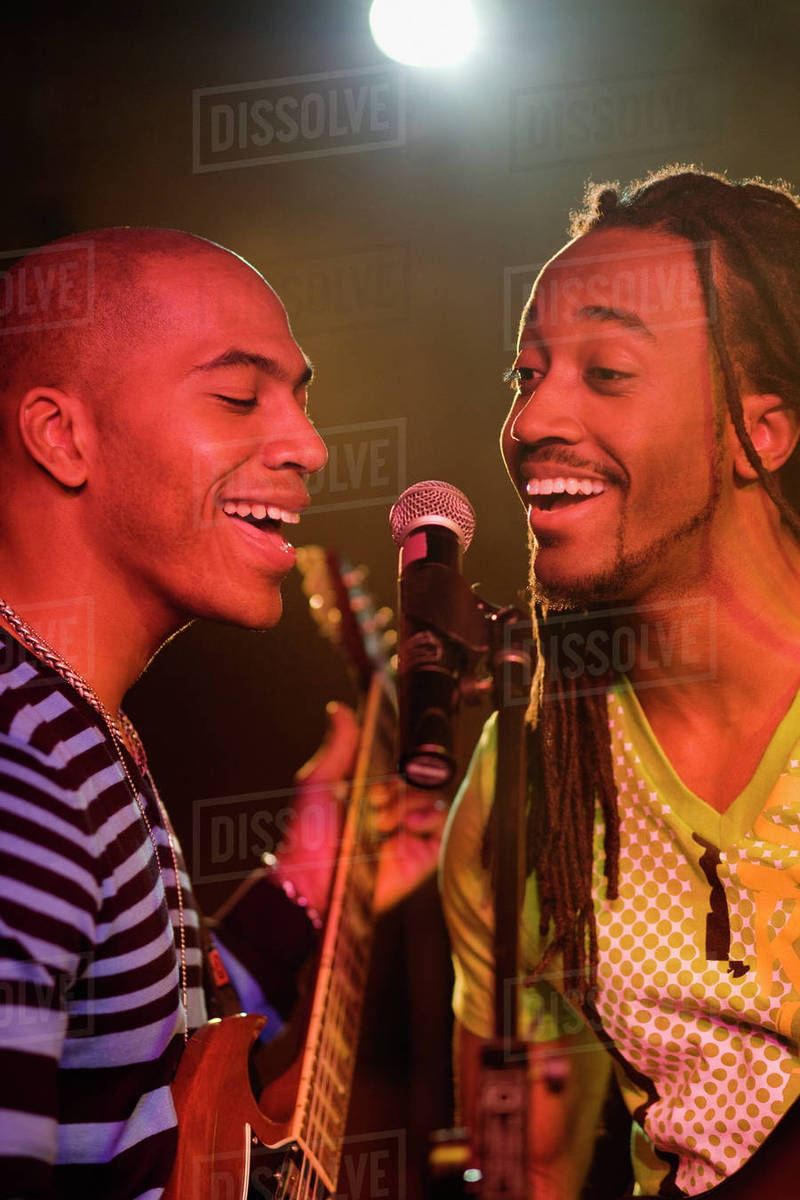 African men singing and playing guitar onstage - Royalty-free Stock ...