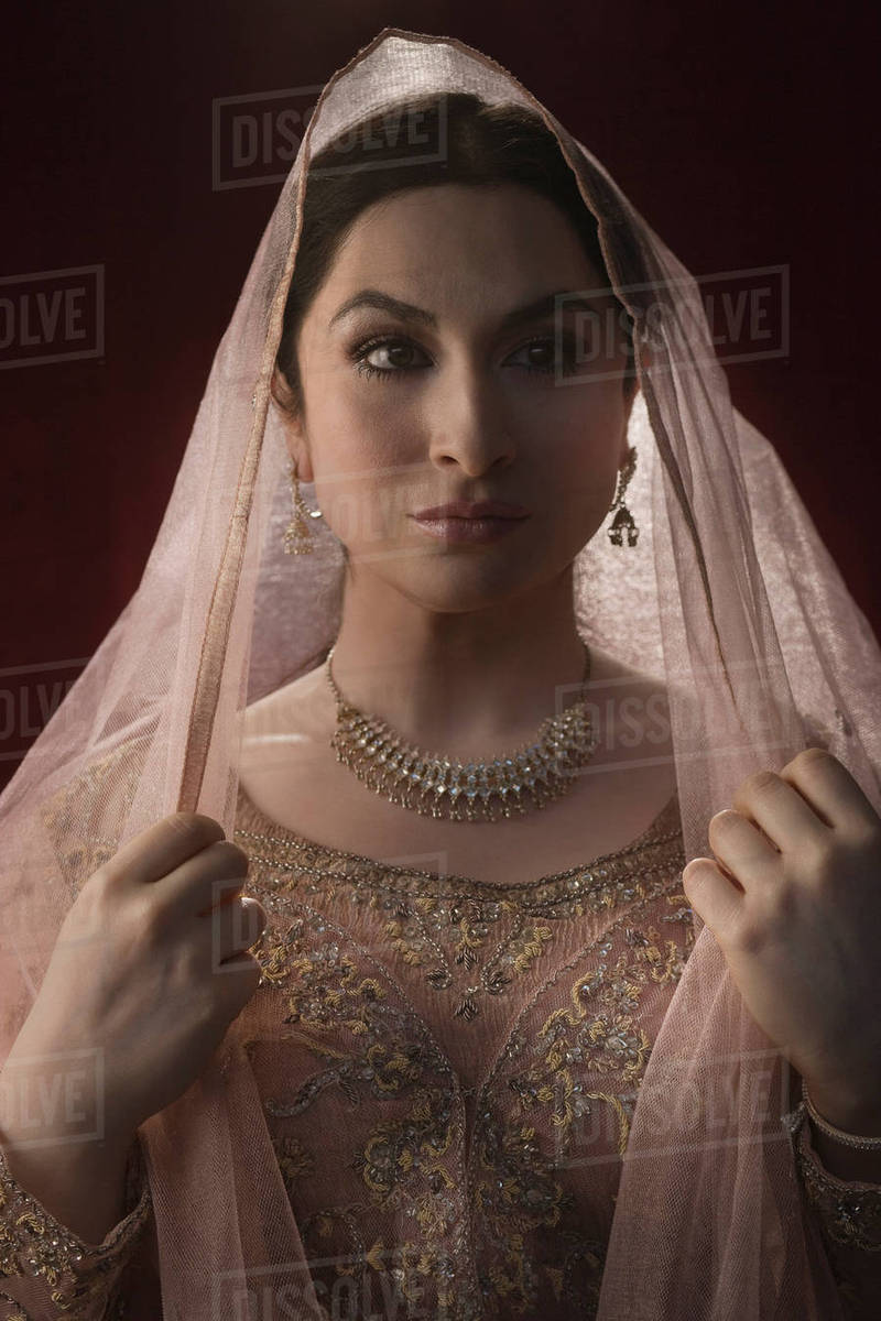 Glamorous Middle Eastern woman in ornate dress and veil - Royalty-free ...