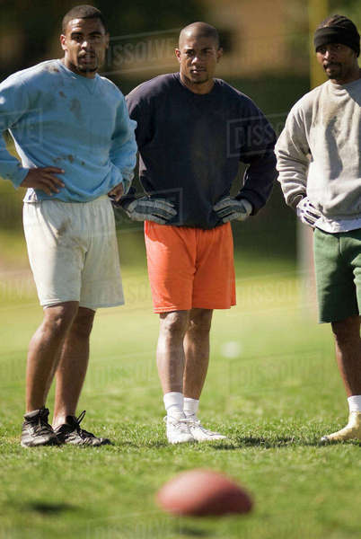 Men playing football - Stock Photo - Dissolve