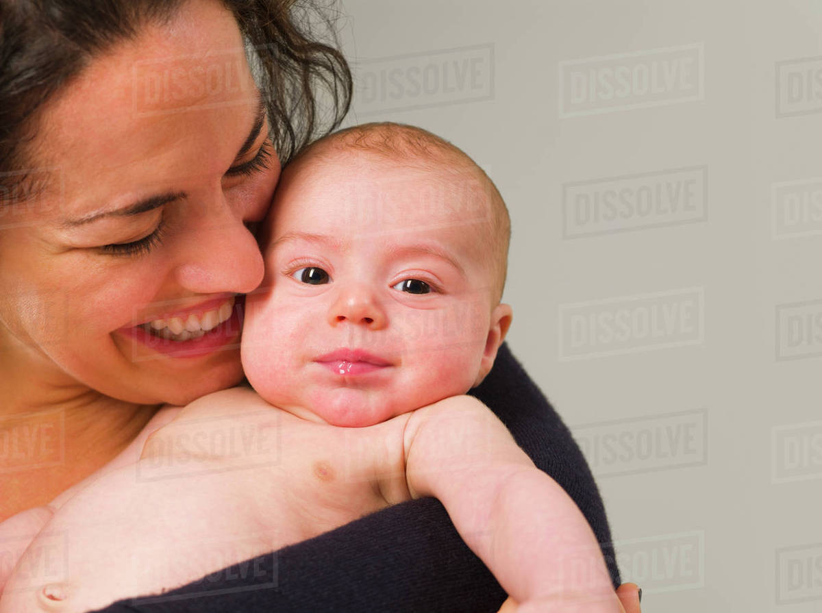 Mother holding newborn baby - Royalty-free Stock Photo | Dissolve