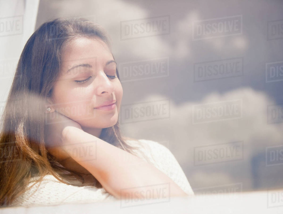 Tranquil Indian woman relaxing - Stock Photo - Dissolve