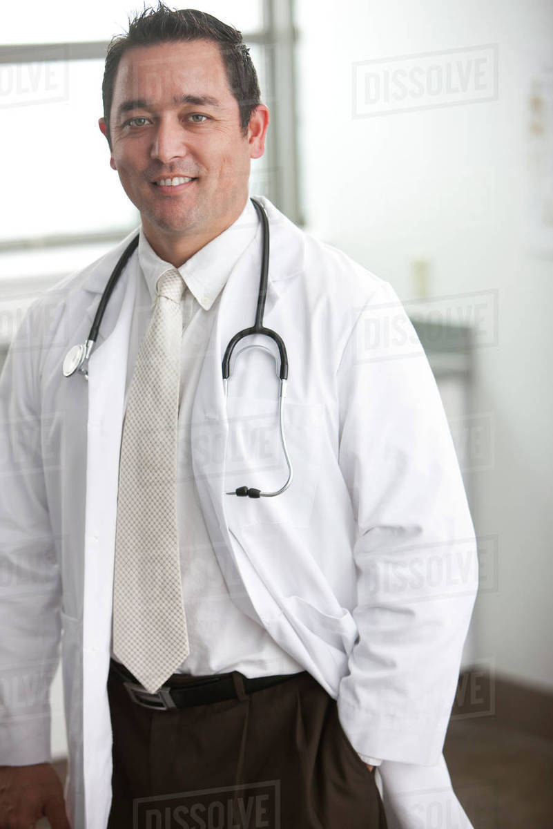 Smiling mixed race doctor - Royalty-free Stock Photo | Dissolve