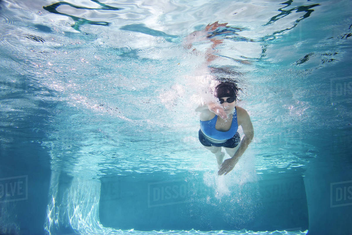 Caucasian woman swimming in swimming pool - Royalty-free Stock Photo ...