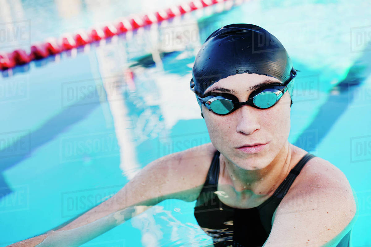 Competitive swimmer in swimming pool - Stock Photo - Dissolve