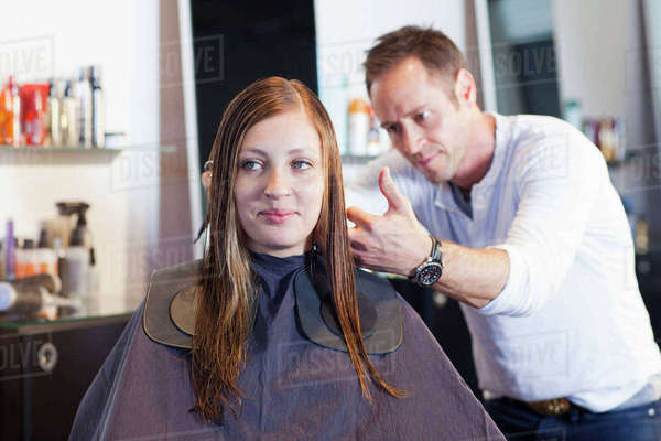 Woman having haircut in salon - Royalty-free Stock Photo | Dissolve