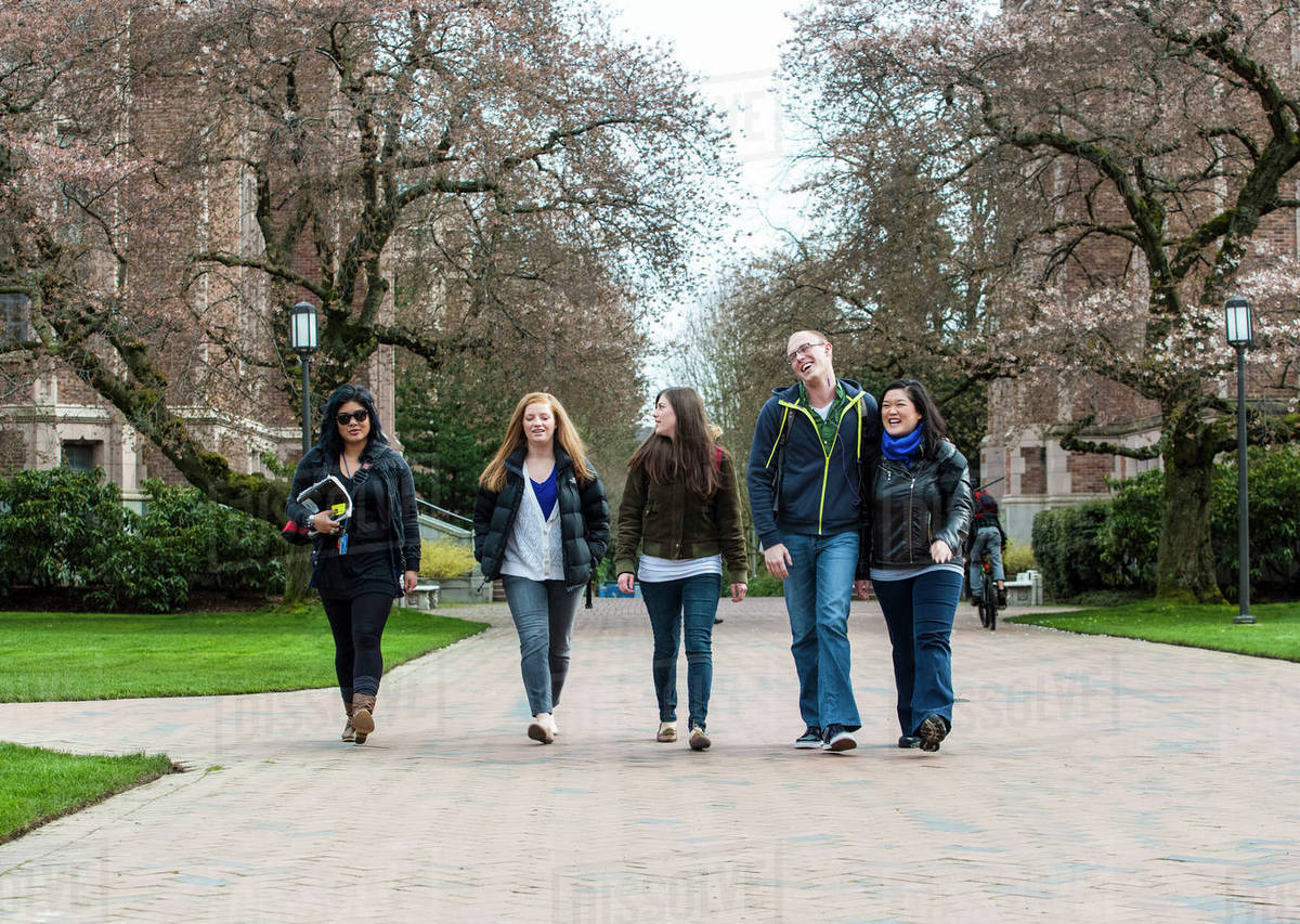 Students walking on campus together - Royalty-free Stock Photo | Dissolve
