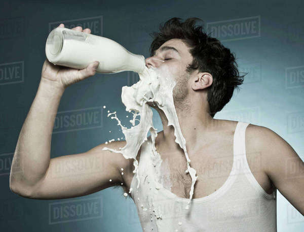 Caucasian man drinking milk and spilling it - Royalty-free Stock Photo ...