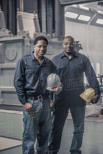 African American workers standing together in factory - Royalty-free ...