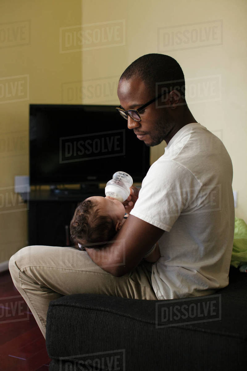 Father feeding baby - Royalty-free Stock Photo | Dissolve