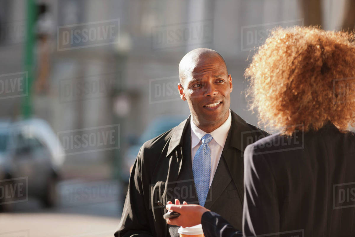 Business people talking together outdoors - Royalty-free Stock Photo ...