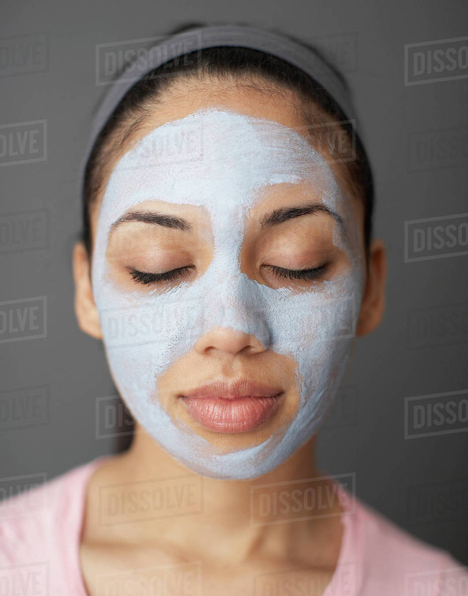 Woman with facial mask - Royalty-free Stock Photo | Dissolve