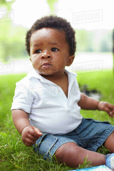 African American baby sitting in grass - Royalty-free Stock Photo ...