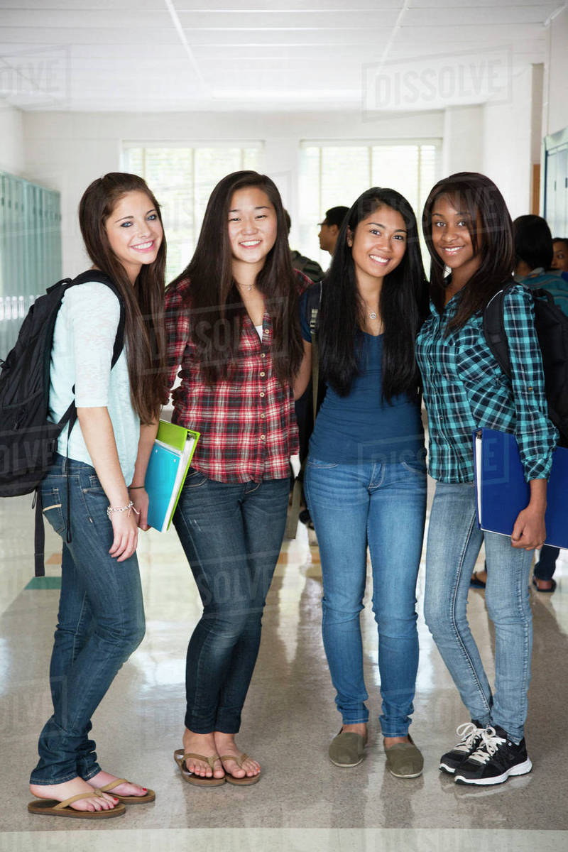 High school friends standing in corridor together - Royalty-free Stock ...