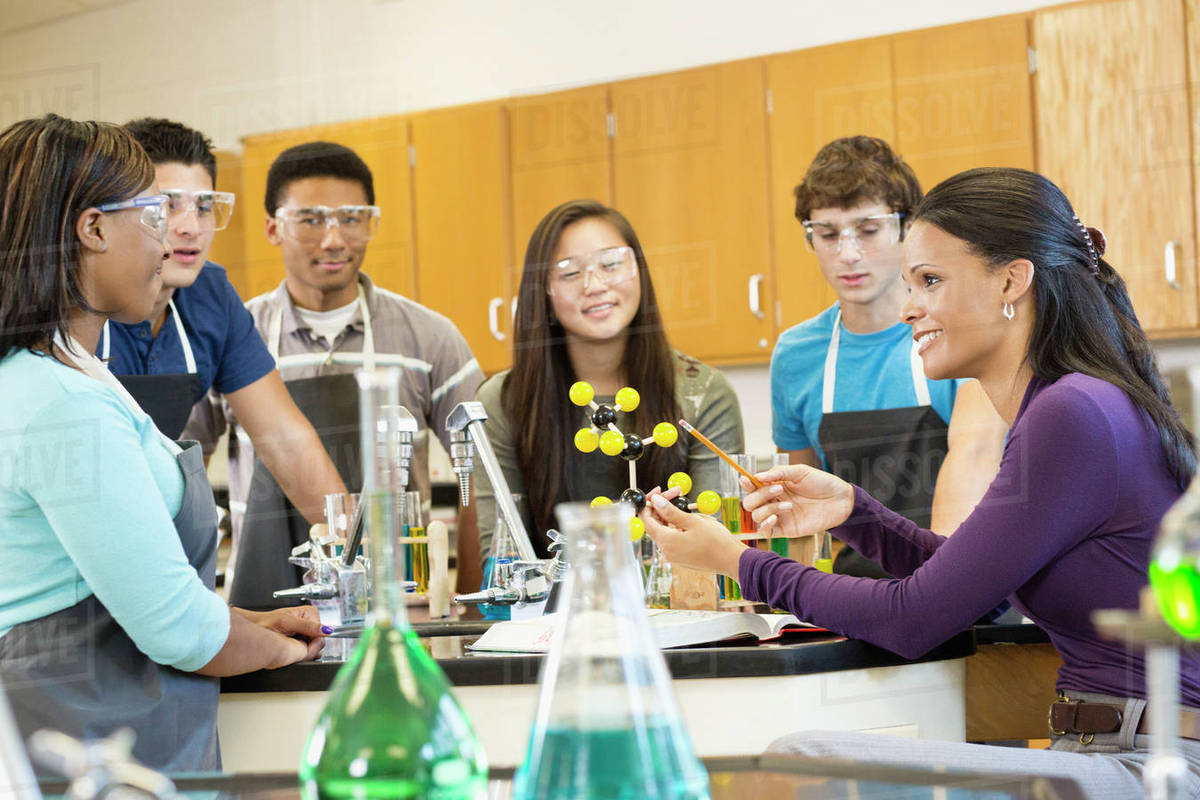 Teacher explaining chemistry model to students - Royalty-free Stock ...