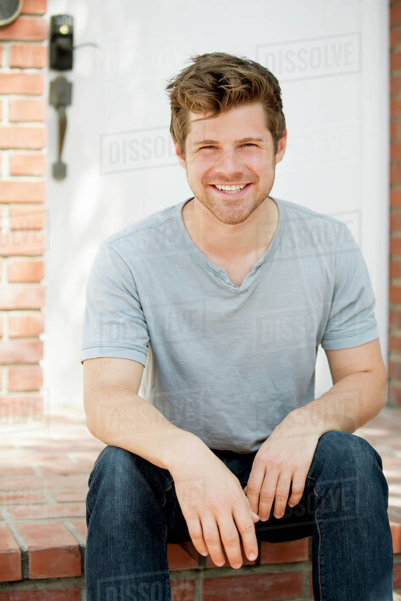 Man smiling outdoors - Royalty-free Stock Photo | Dissolve