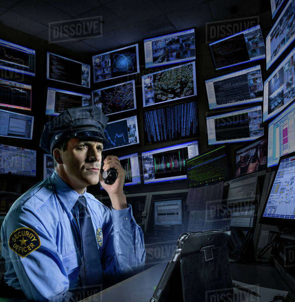 Police officer working in control room - Royalty-free Stock Photo ...