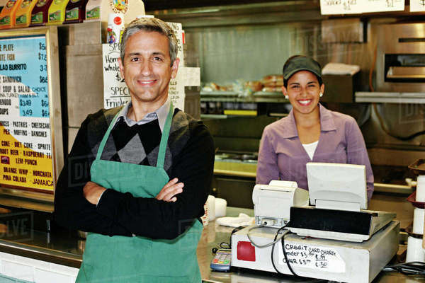 Hispanic servers smiling in restaurant - Royalty-free Stock Photo ...