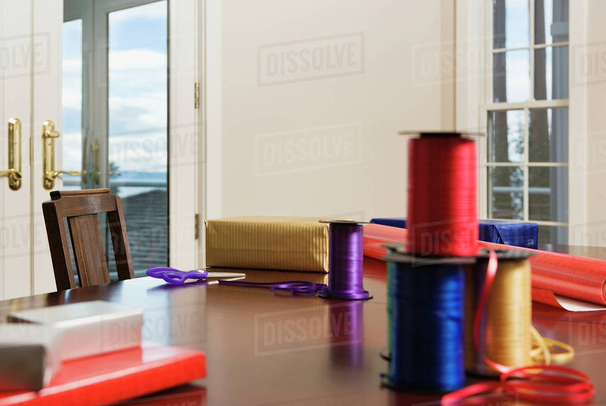 Holiday Ribbon on Table - Royalty-free Stock Photo | Dissolve