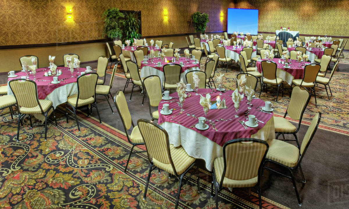 Tables in empty banquet room - Royalty-free Stock Photo | Dissolve