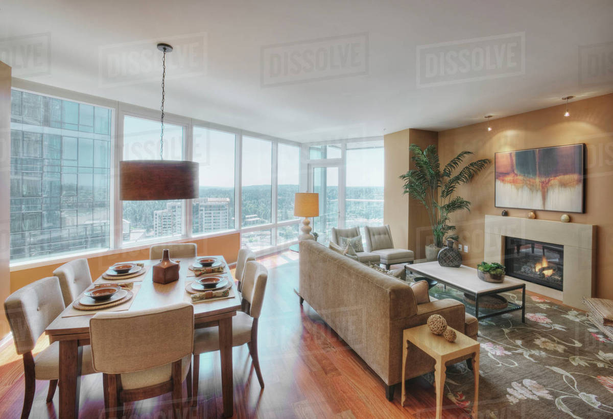 Living room and dining room in luxury highrise apartment - Royalty-free ...