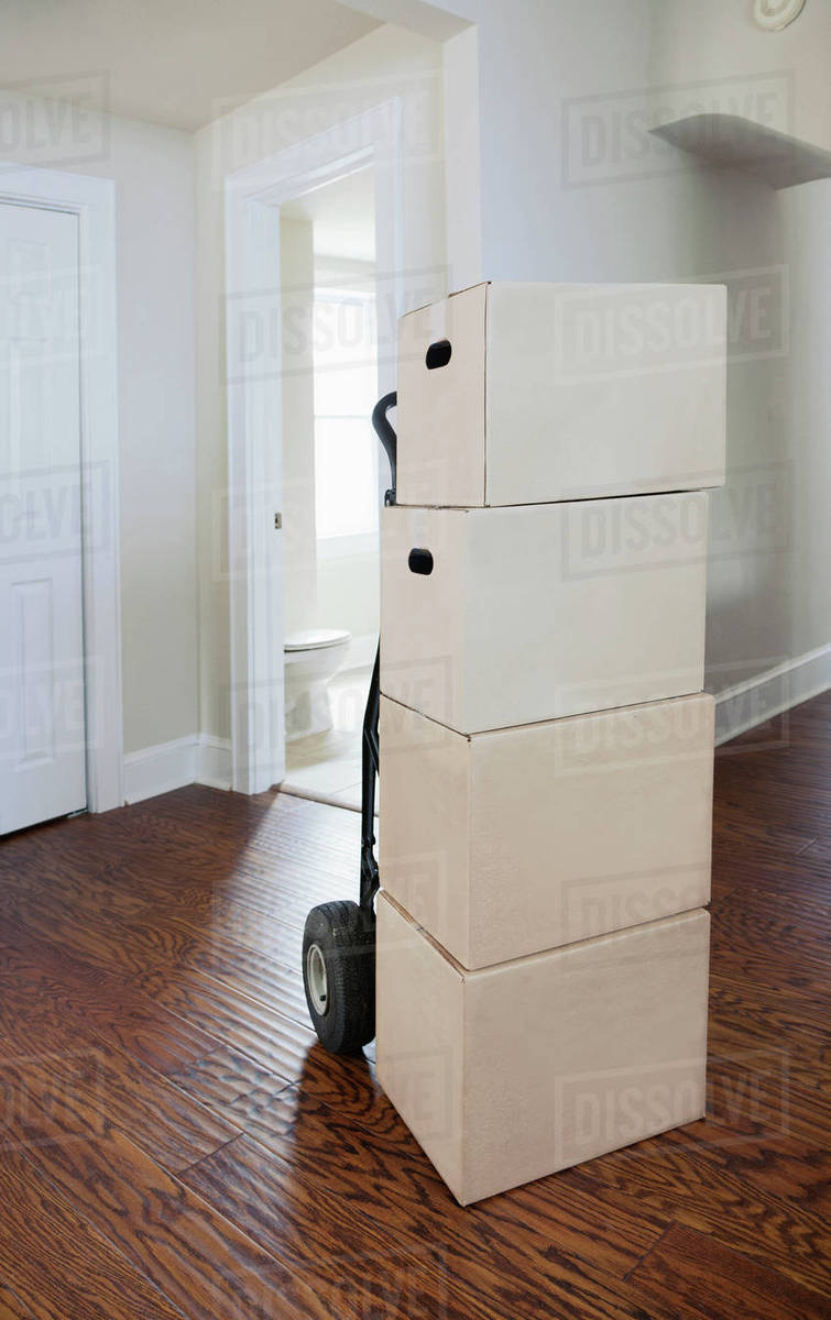Boxes and cartons stacked in a house - Royalty-free Stock Photo | Dissolve