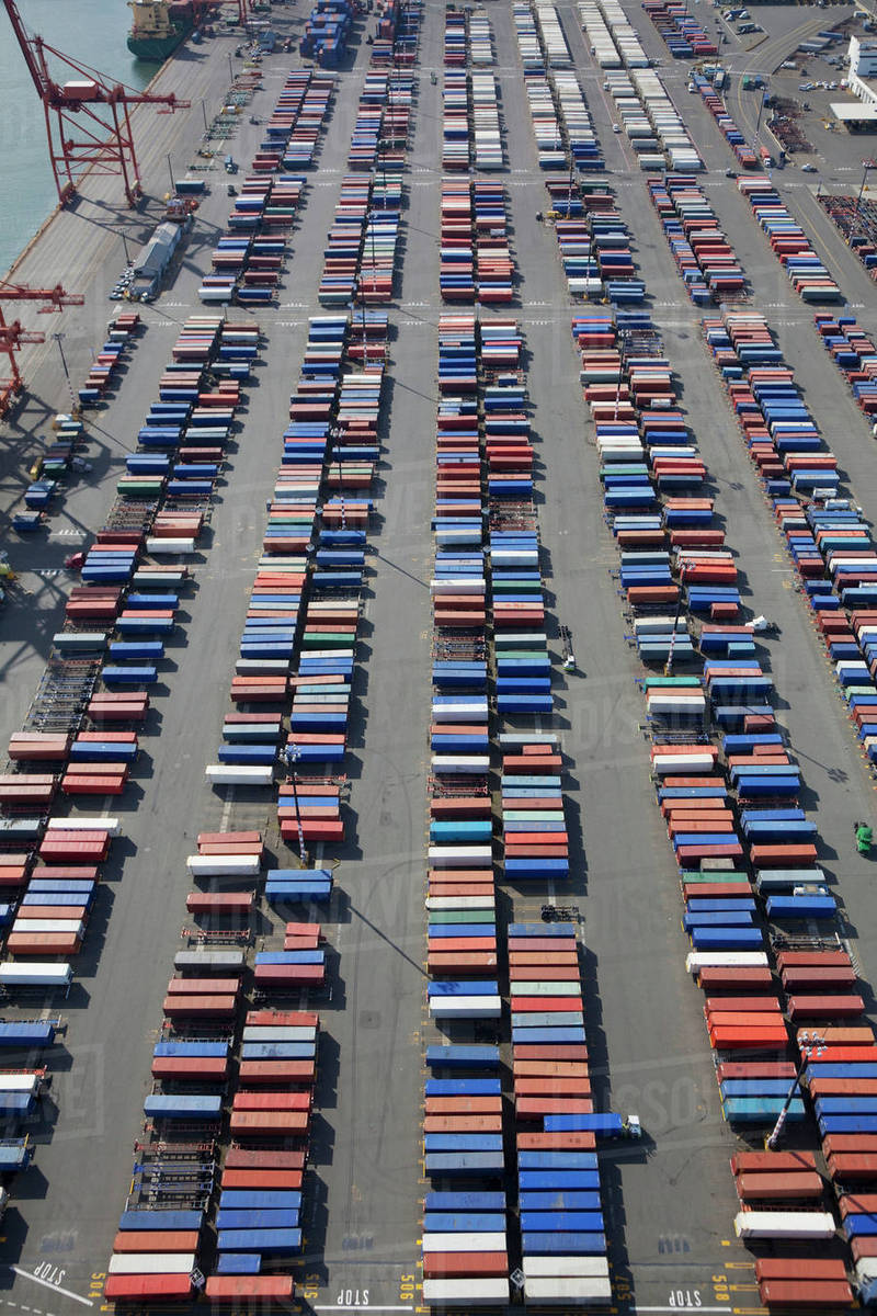 Cargo containers in a row at commercial dock - Royalty-free Stock Photo ...