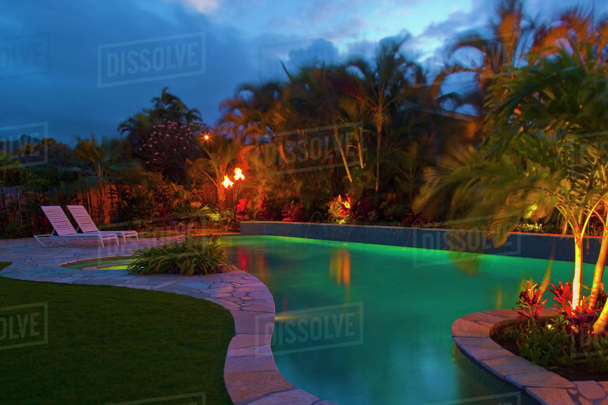 Tropical Backyard Pool at Night - Royalty-free Stock Photo | Dissolve