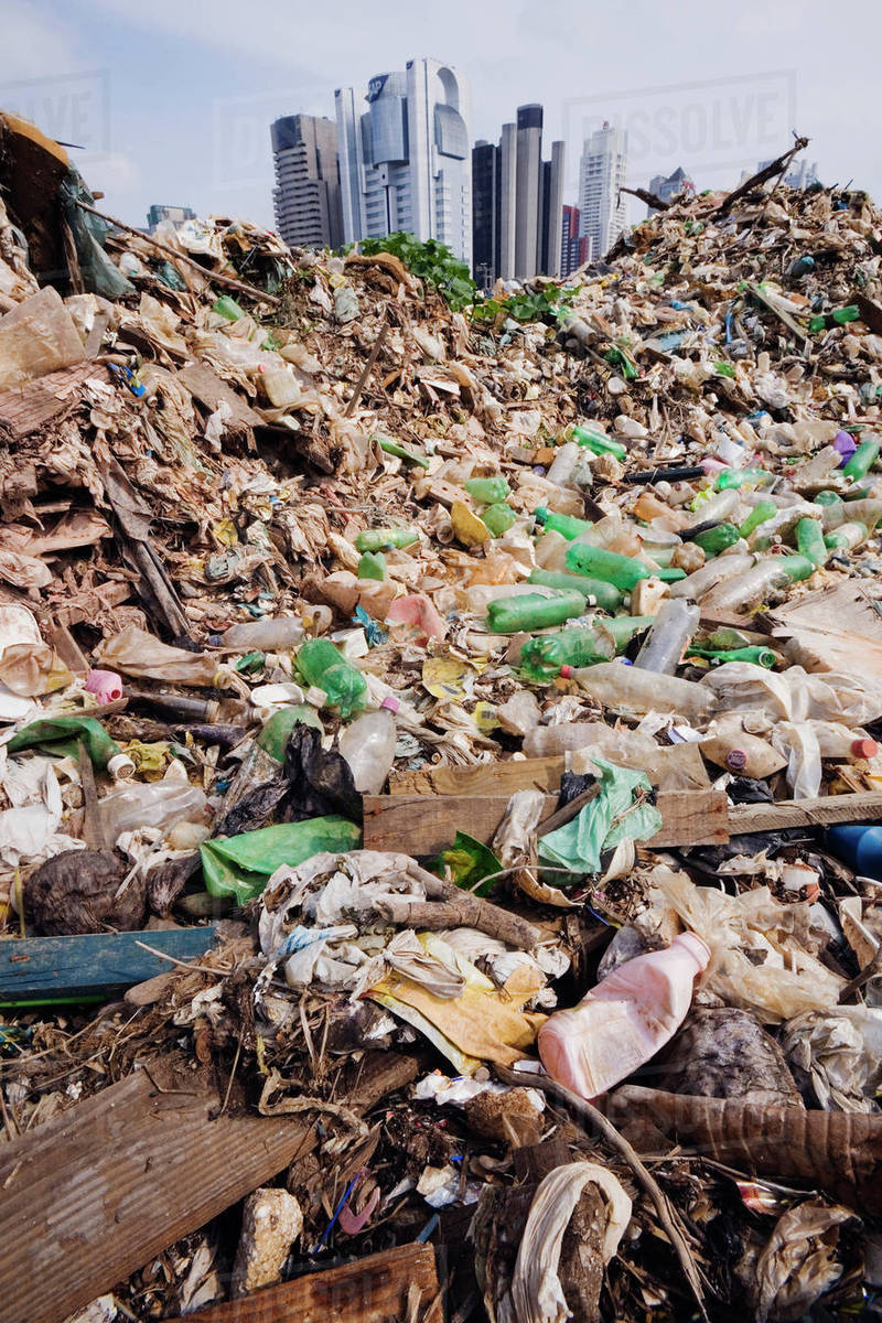 Trash Mound with Modern Office Buildings Behind - Royalty-free Stock ...