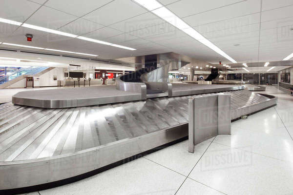 Empty baggage claim area in airport - Stock Photo - Dissolve