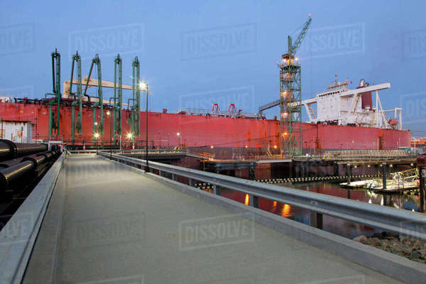 Concrete walkway to container ship in shipyard - Royalty-free Stock ...