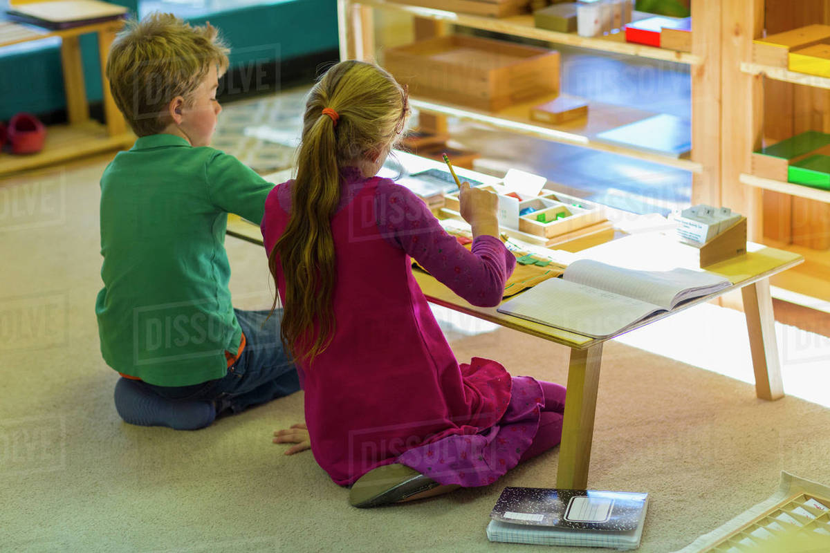 Caucasian children at table in classroom - Royalty-free Stock Photo ...