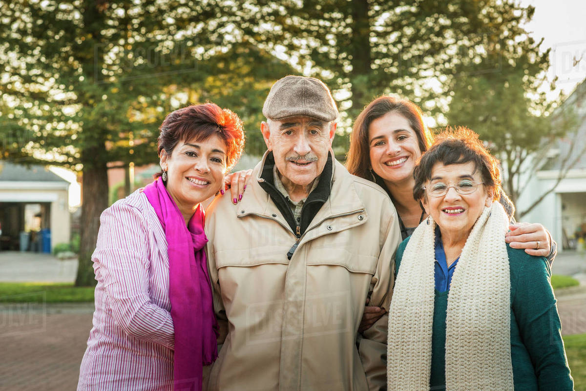 Hispanic Multi-generation family smiling outdoors - Royalty-free Stock ...