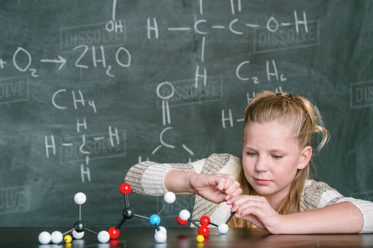 Caucasian student building molecular model in science class - Stock ...