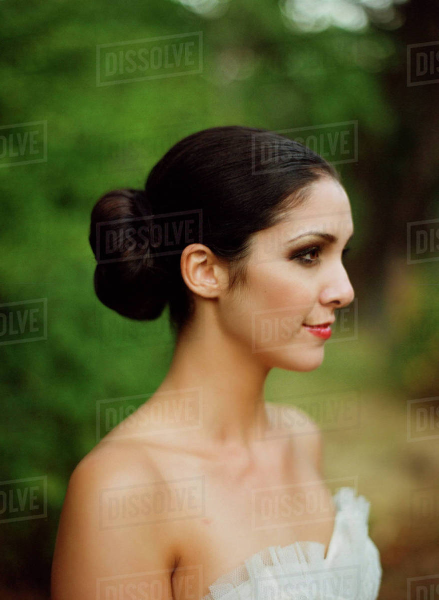 Profile view of bride wearing wedding dress outdoors - Stock Photo ...