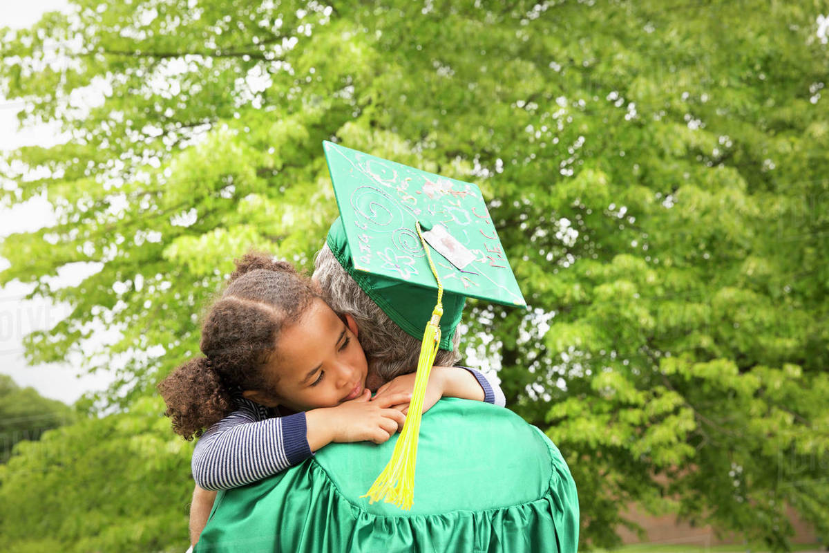 College graduate father hugging daughter - Royalty-free Stock Photo ...
