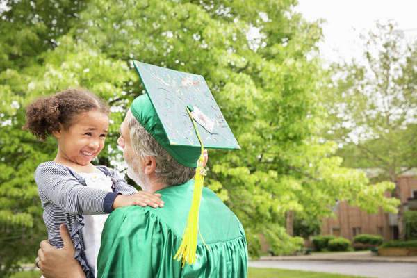 College graduate father hugging daughter - Royalty-free Stock Photo ...