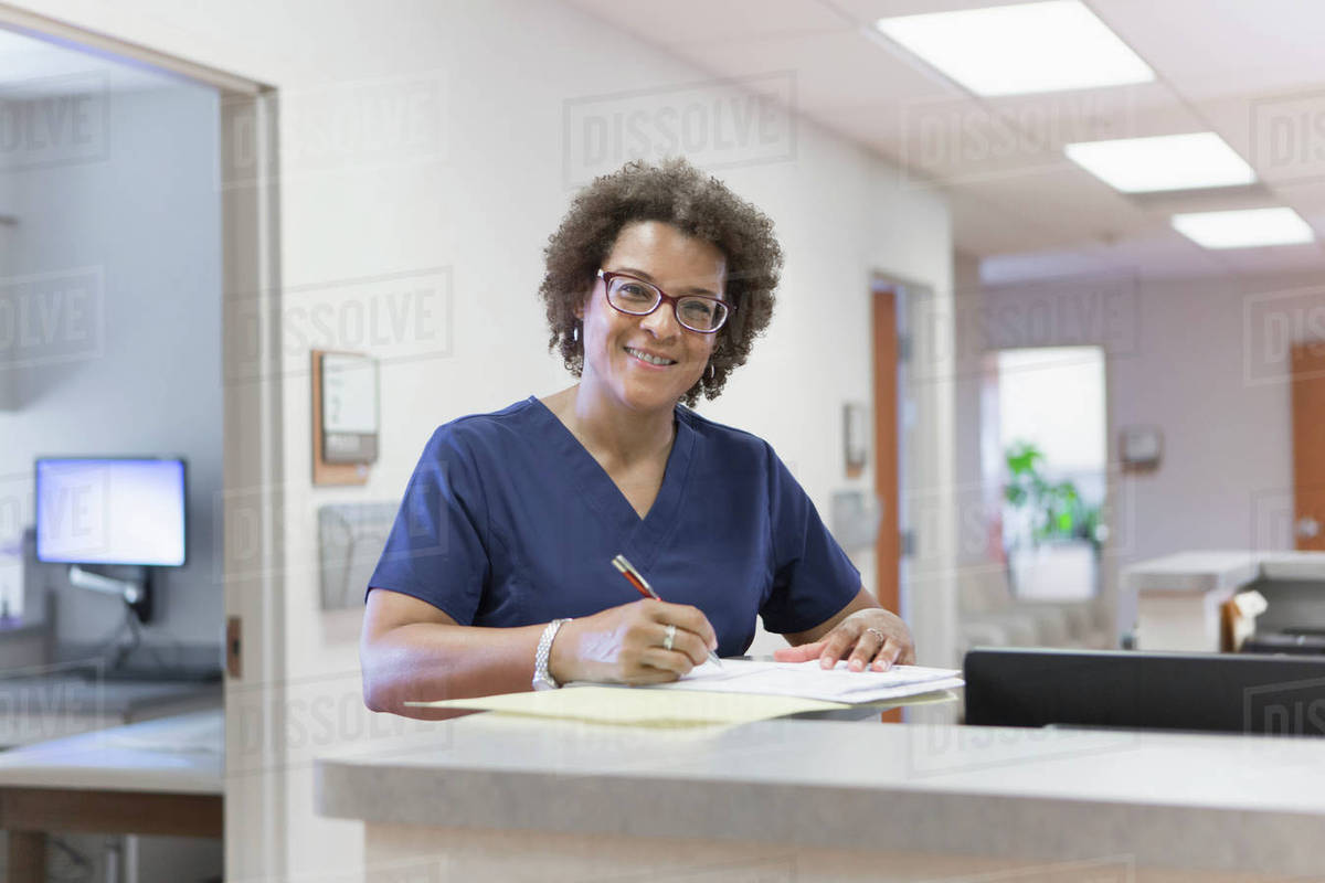 African American nurse writing in hospital - Royalty-free Stock Photo ...