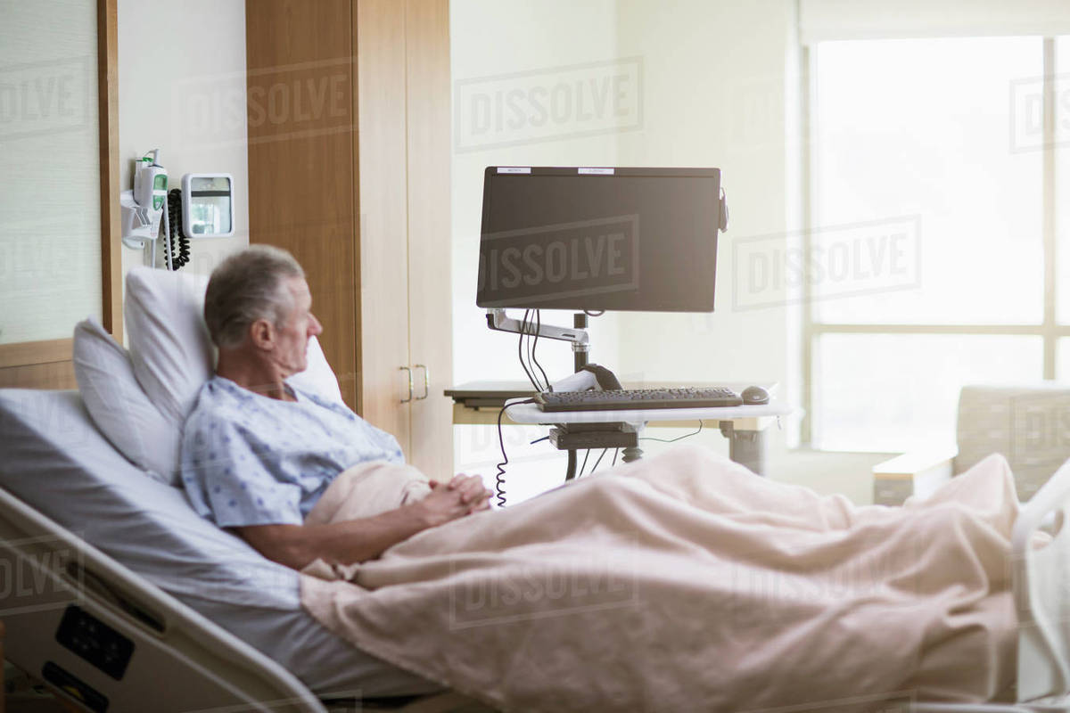 Caucasian patient sitting in hospital bed - Royalty-free Stock Photo ...