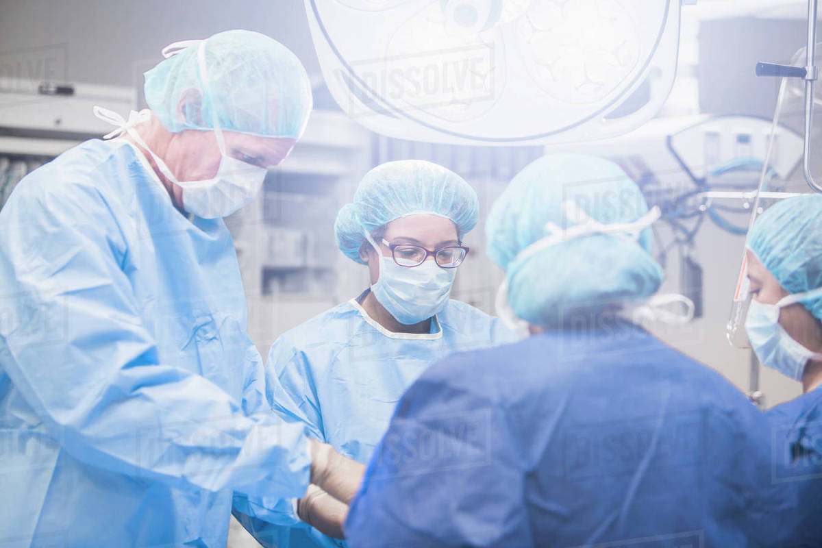 Surgeons working in operating room - Royalty-free Stock Photo | Dissolve