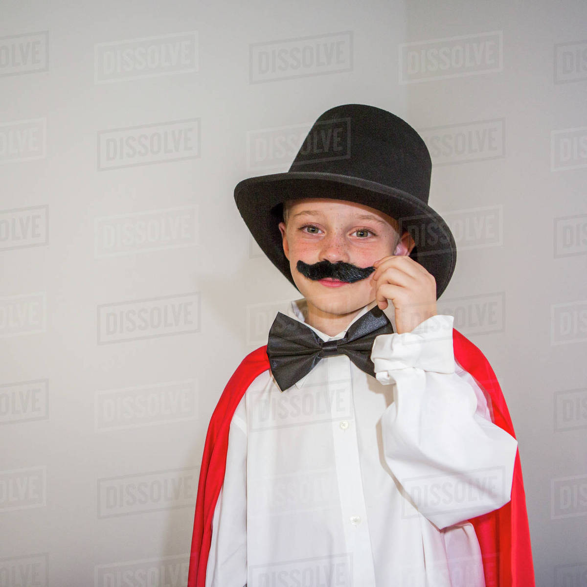 Caucasian magician twirling mustache - Royalty-free Stock Photo | Dissolve