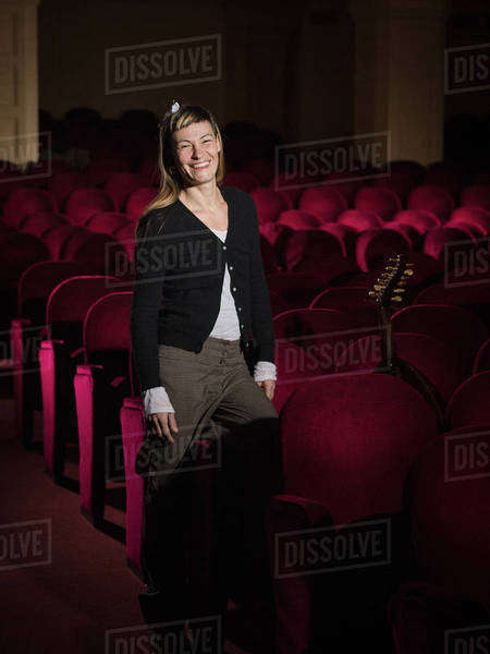 Caucasian woman standing in movie theater - Royalty-free Stock Photo ...
