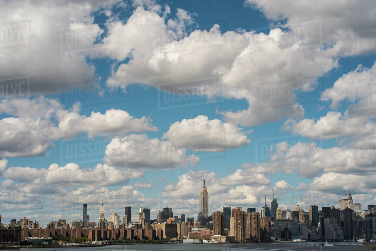New York City skyline under cloudy blue sky, New York, United States ...