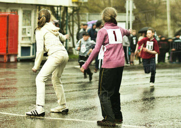 Caucasian children preparing for race on street - Royalty-free Stock ...