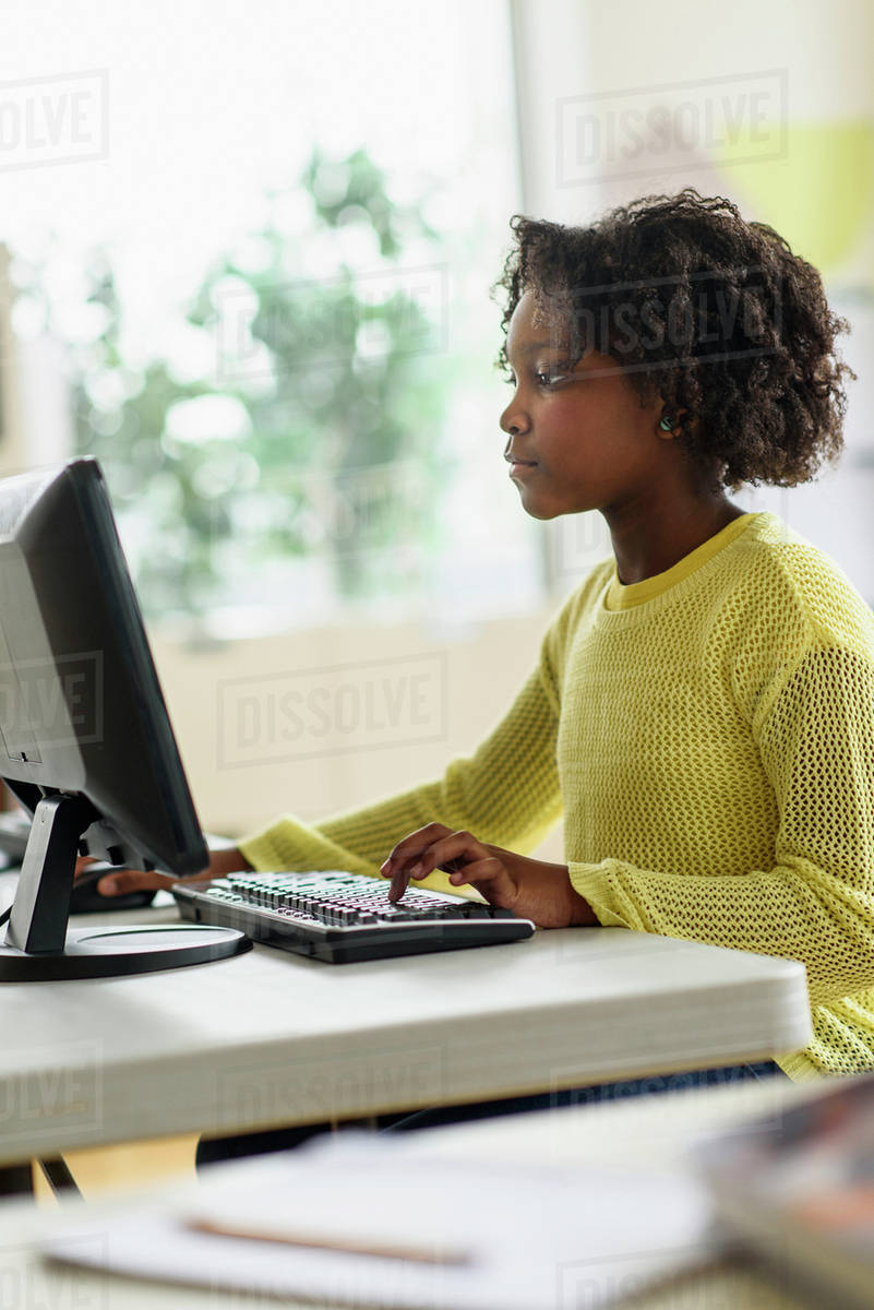 Black student using computer in classroom - Royalty-free Stock Photo ...
