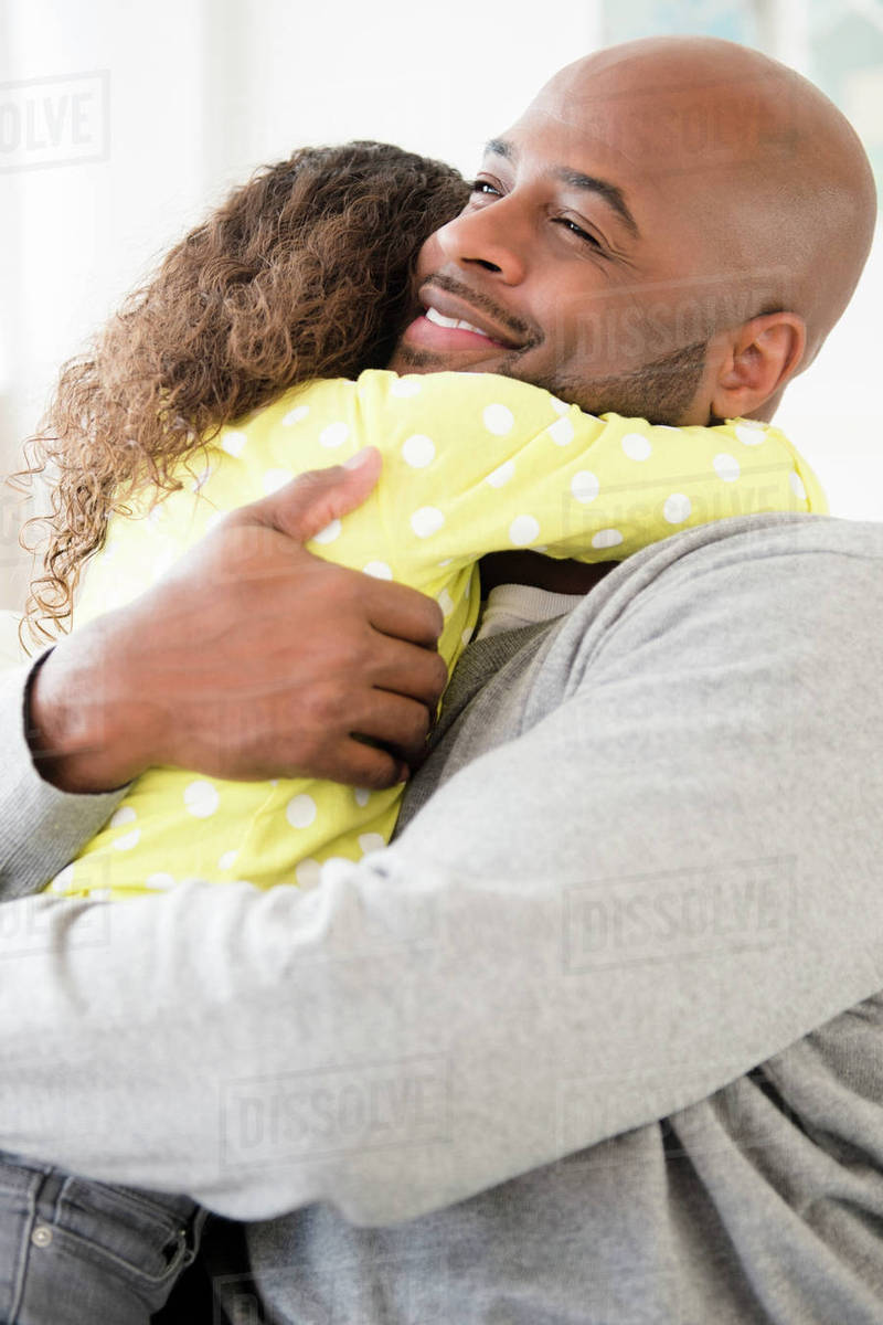 Father and daughter hugging - Royalty-free Stock Photo | Dissolve
