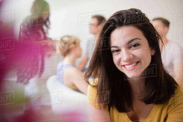 Portrait of woman smiling at party - Royalty-free Stock Photo | Dissolve